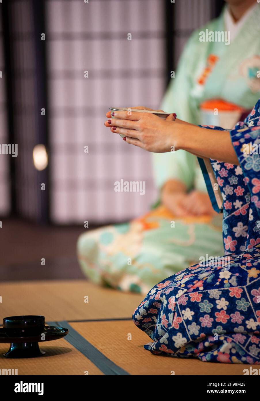 Japanese woman in traditional kimono, kneeling on Seiza position ...
