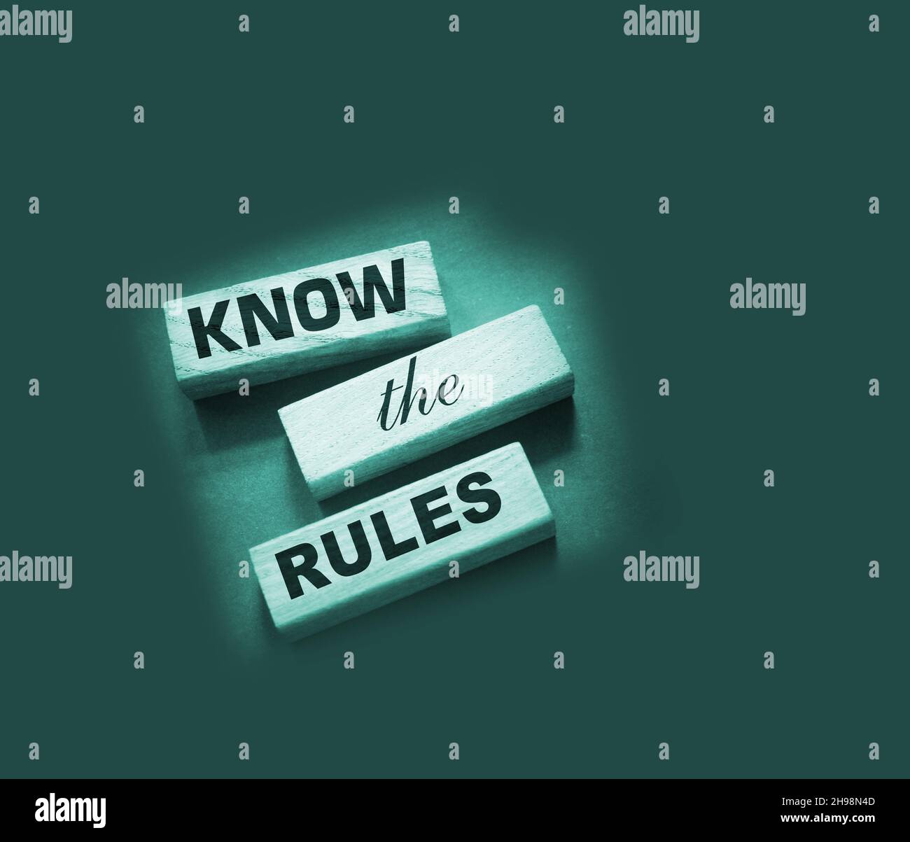 Know the rules word on wooden blocks isolated on dark grey background ...