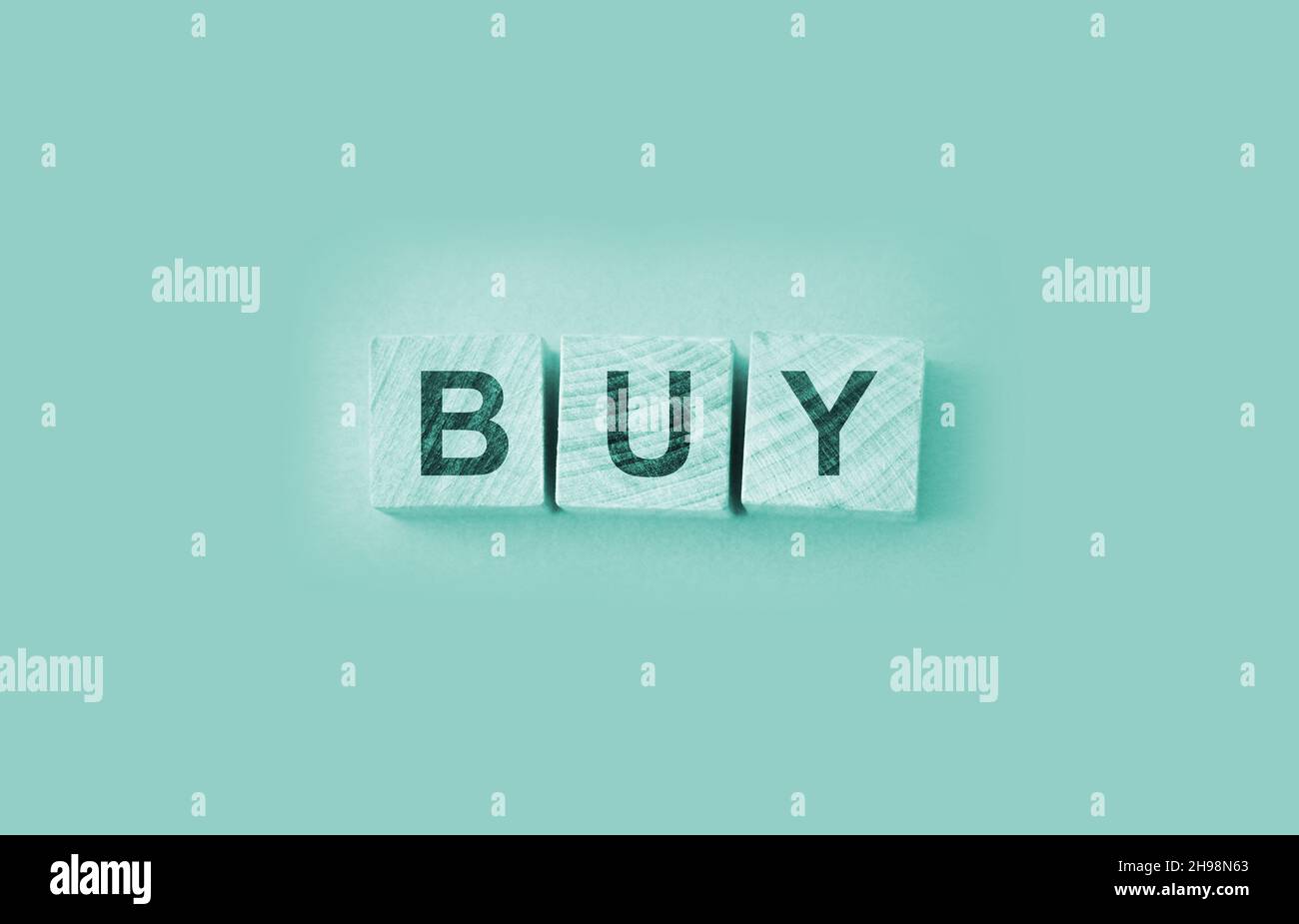 Shopping concept. Wooden cubes with word buy on the yellow background ...