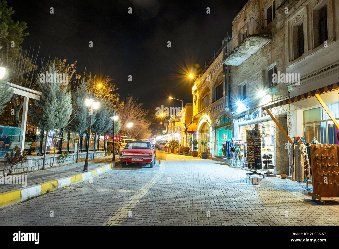 View of old town street and cave hotels of Goreme in Cappadocia at ...
