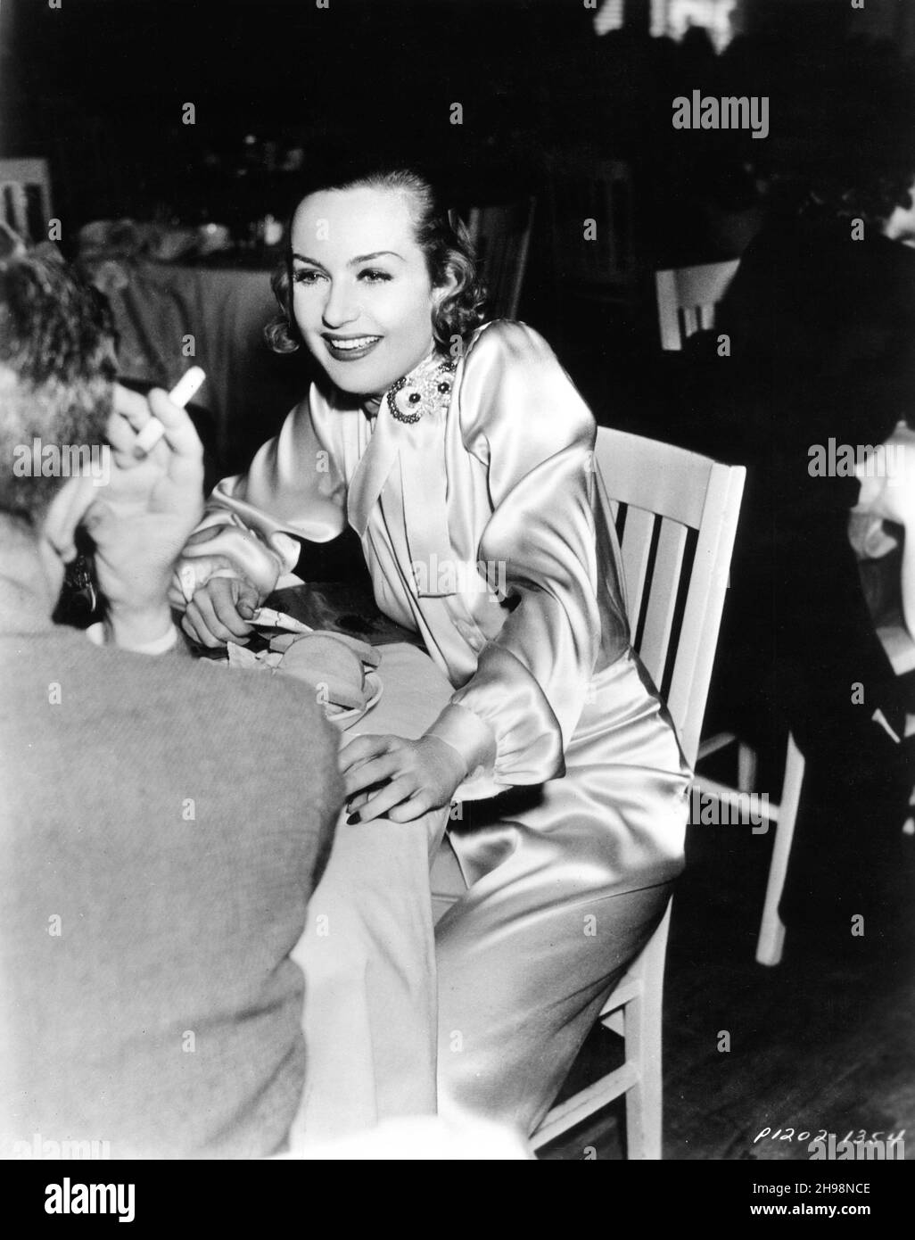 CAROLE LOMBARD candid during lunch at the Paramount Studio Commissary ...