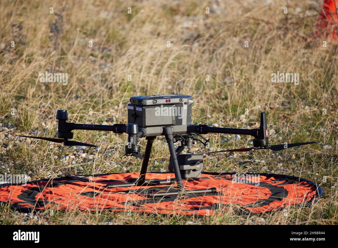 Industrial drone seen stationary on a platform in a field Stock Photo ...