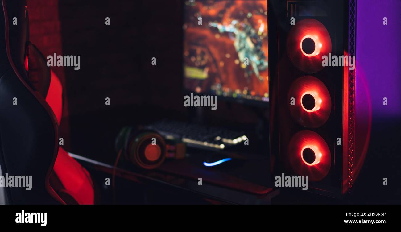 Gaming computer peripherals under red neon light Stock Photo - Alamy