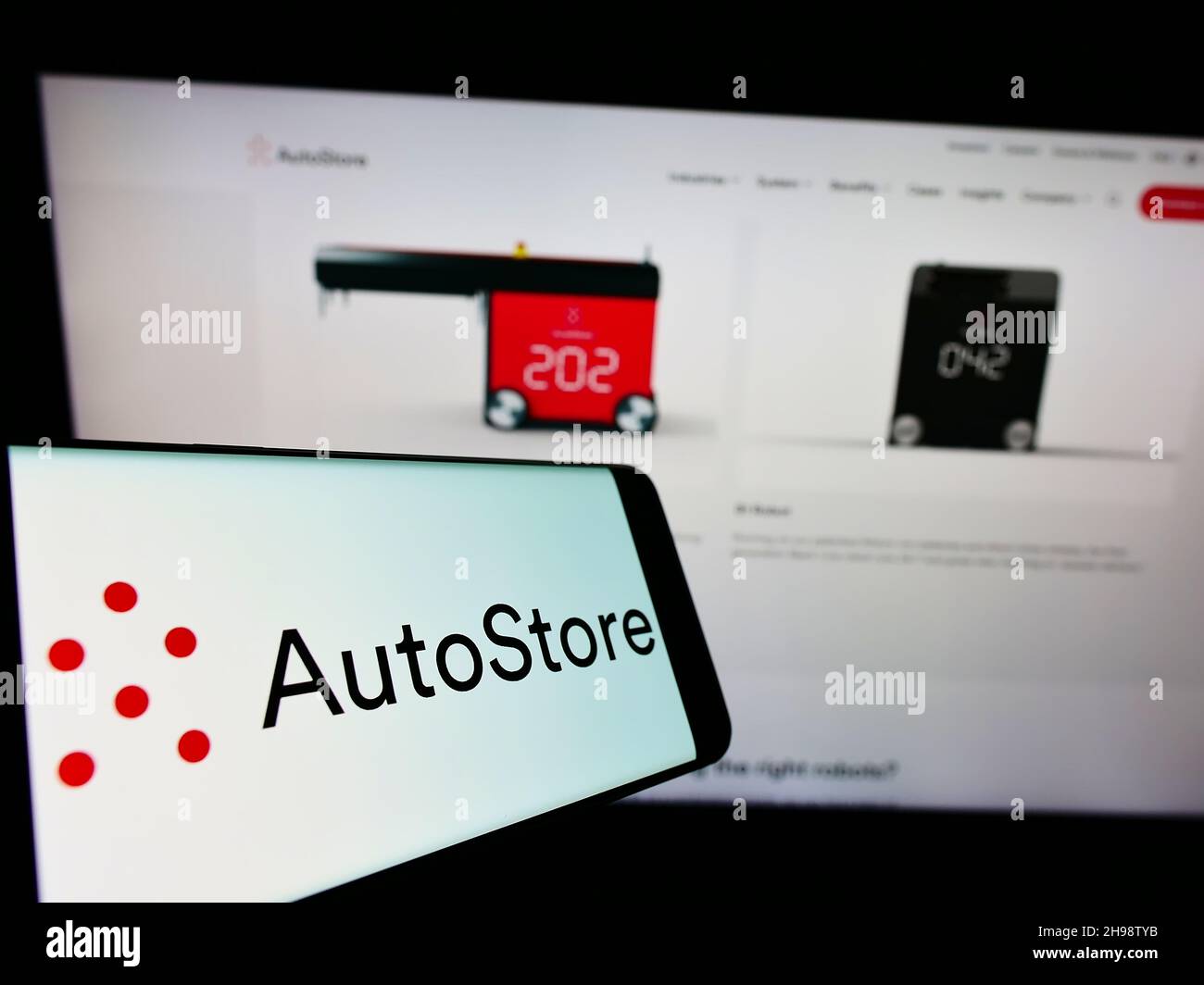 Mobile phone with logo of Norwegian automated storage company AutoStore ...