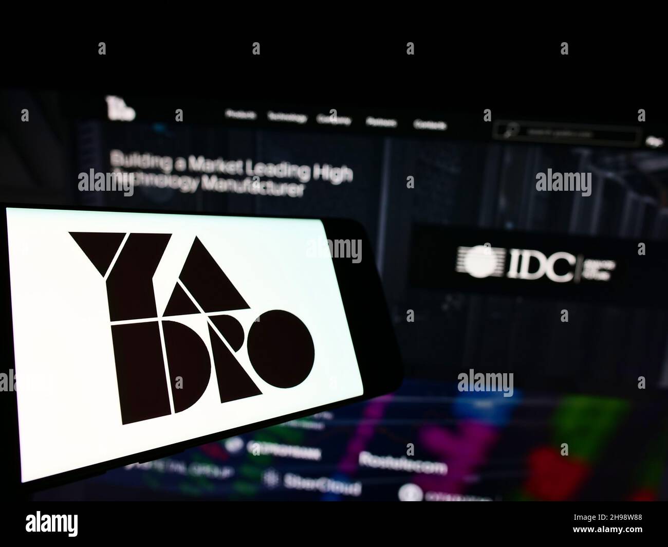 Smartphone with logo of Russian technology company YADRO on screen in ...