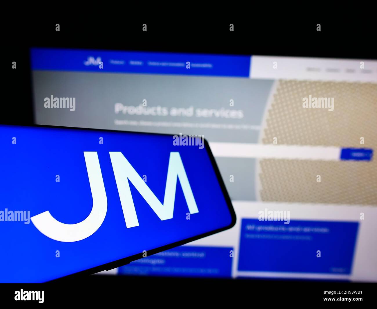 Mobile phone with logo of British chemical company Johnson Matthey plc ...