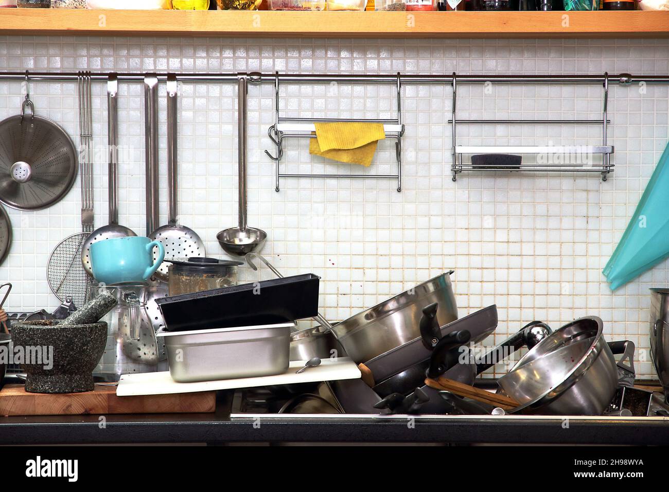 Dirty pan spoon in kitchen hi-res stock photography and images - Alamy