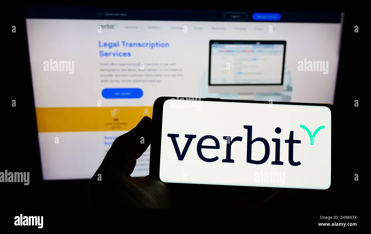 Person holding smartphone with logo of US automated transcription ...