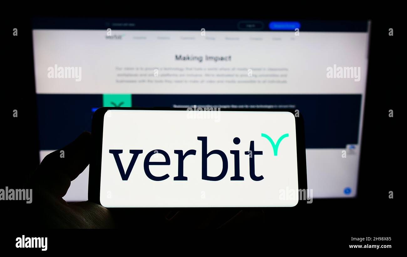 Person holding mobile phone with logo of American automated ...