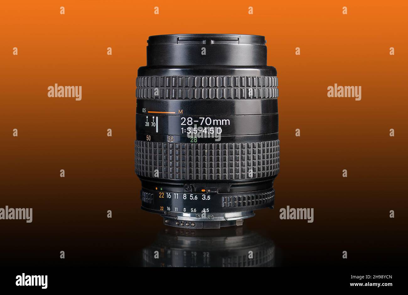 Old DSLR camera lens on color gradient background with reflection Stock ...