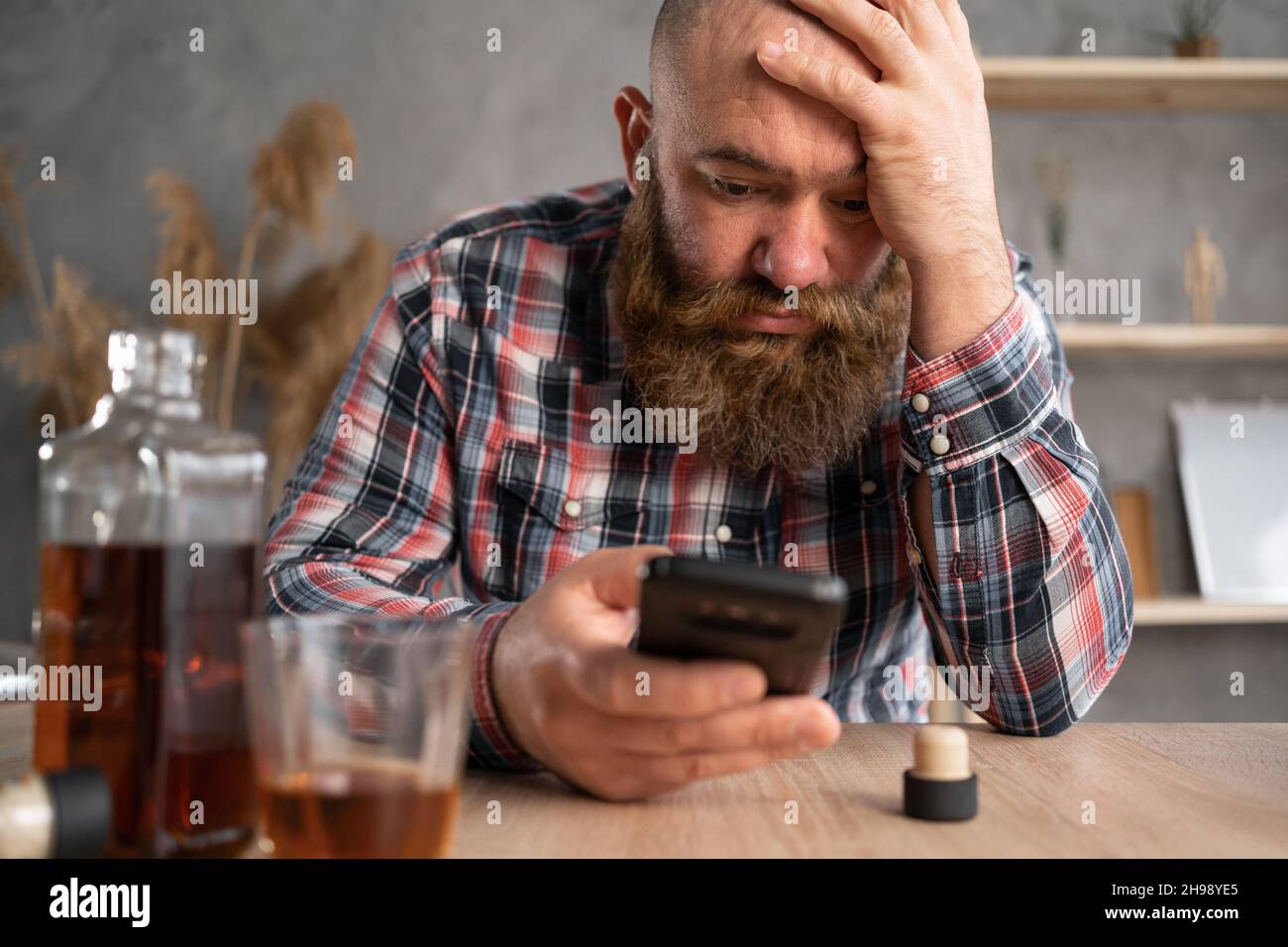 alcoholism, alcohol addiction and people concept a bearded alcoholic ...