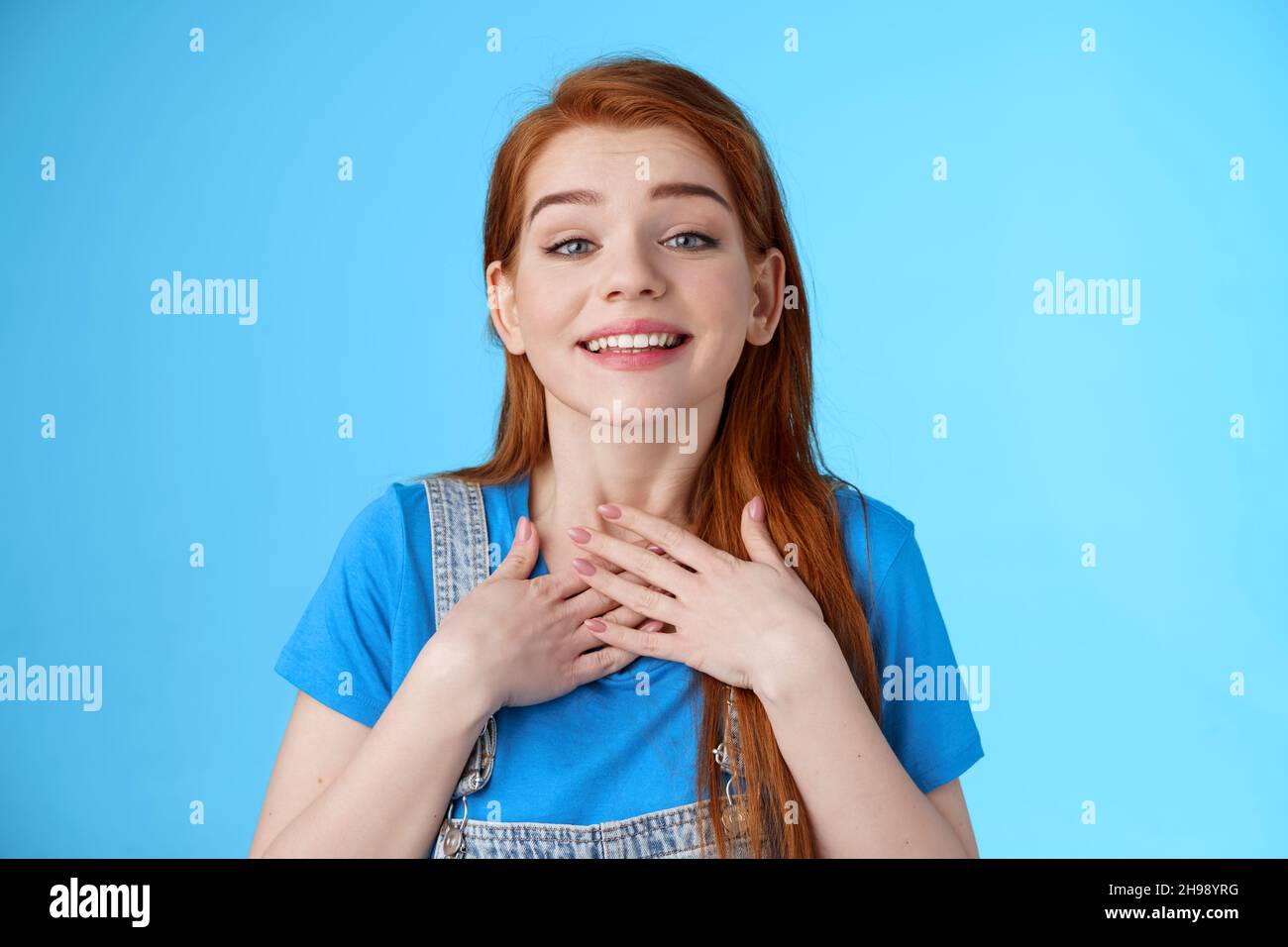 Grateful sincere cute charming redhead female thanking friends, smiling ...