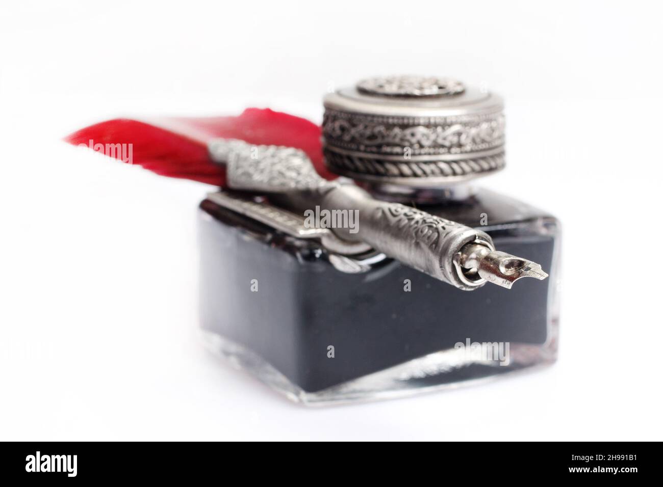 Old vintage red fountain pen with inkwell on white background Stock ...