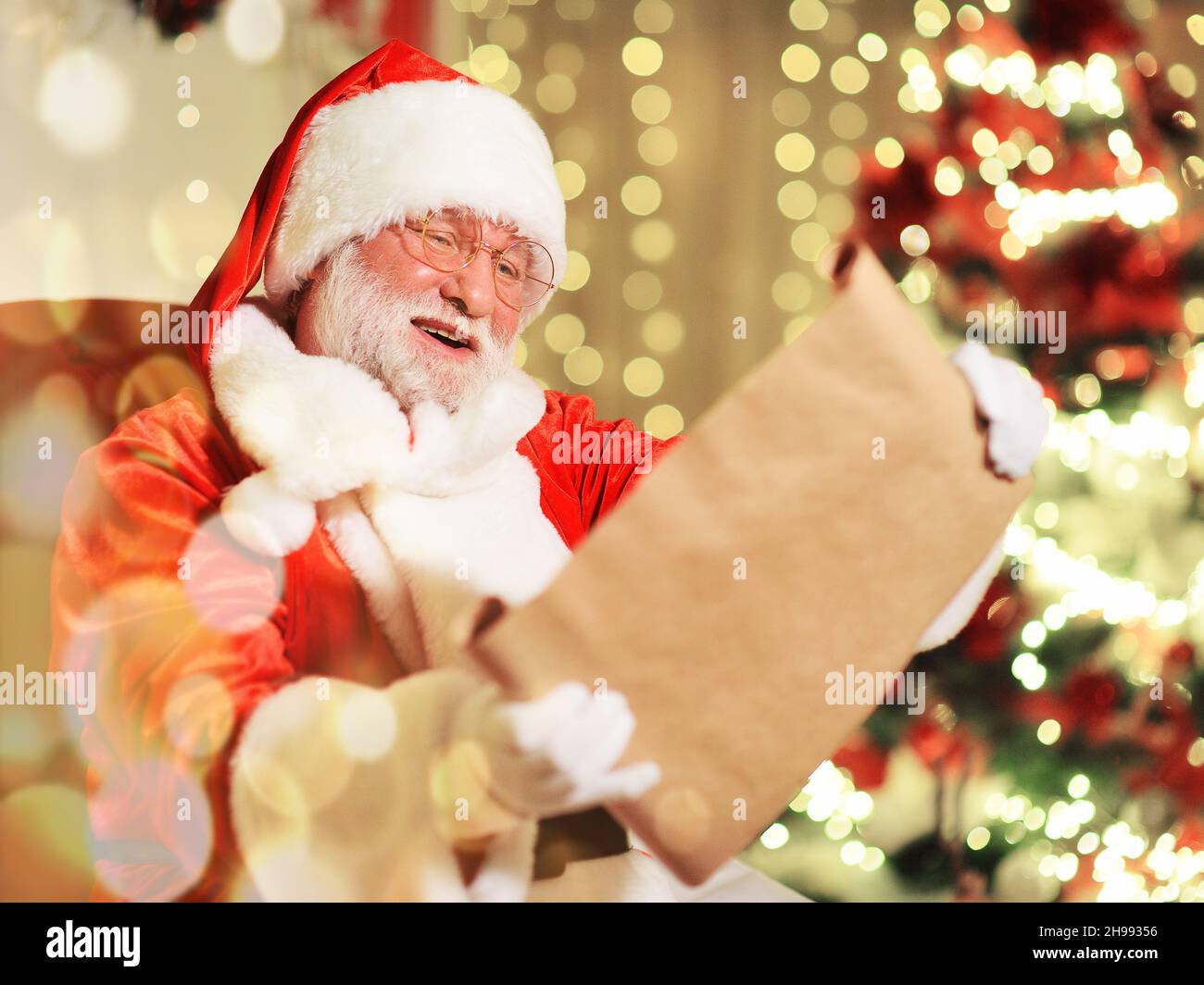 Santa Claus with a real white beard in a traditional red and white suit ...