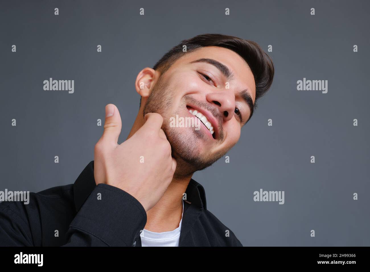Touching his chin hi-res stock photography and images - Alamy