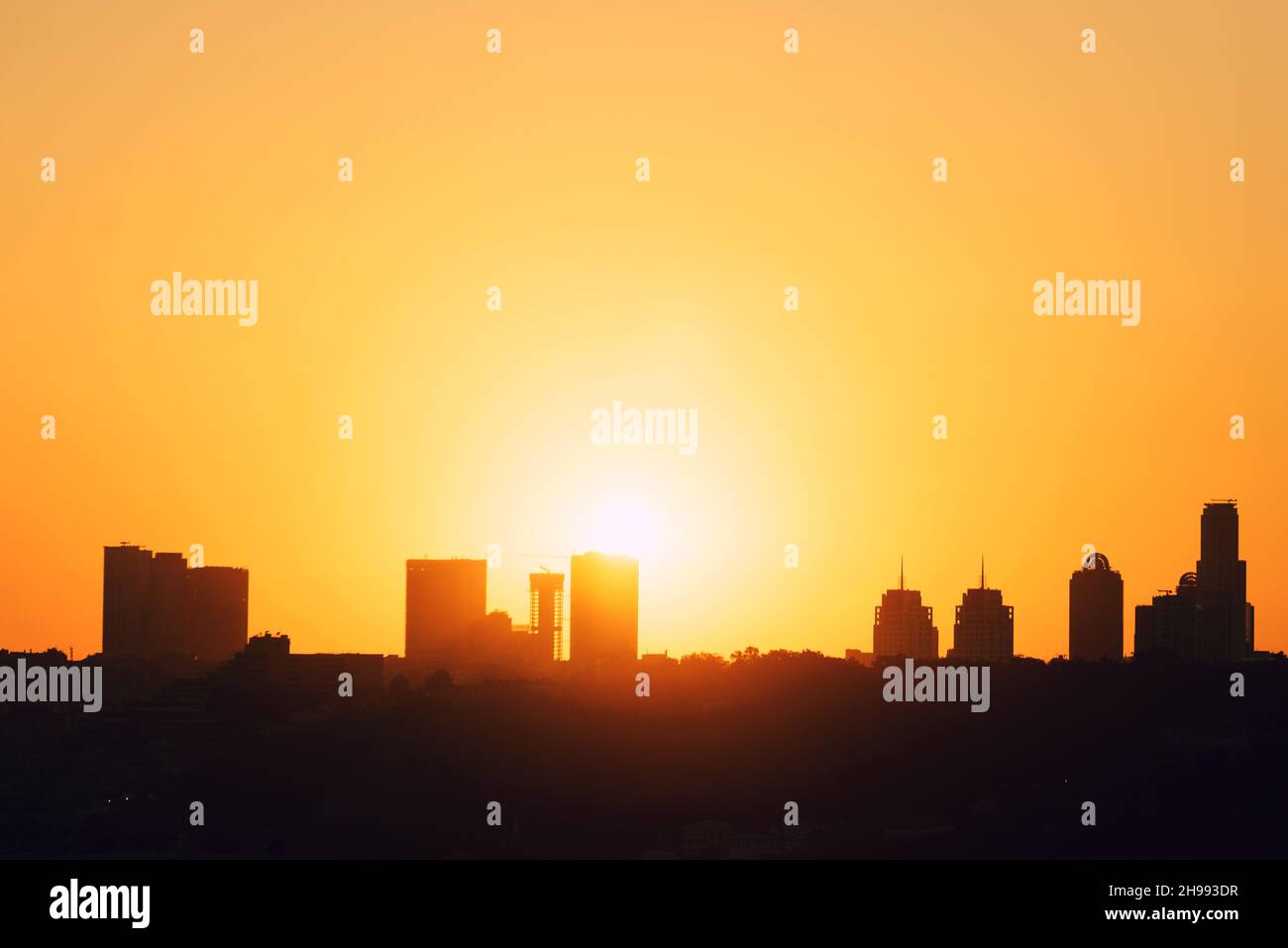 Sunset behind buildings in istanbul. Building silhouettes Stock Photo ...