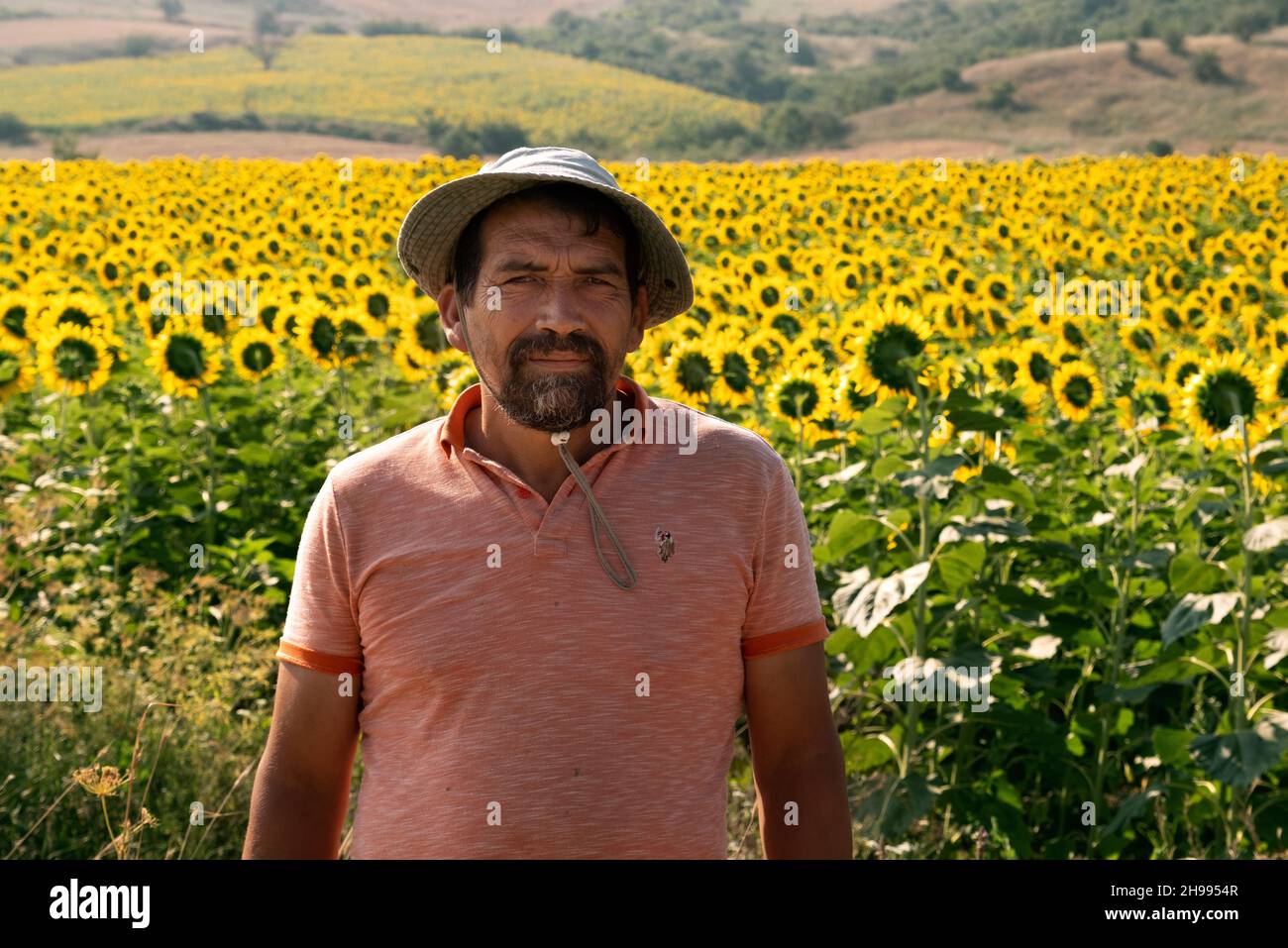 Istanbul, Turkey - July 15, 2021: Portrait of a farmer in the sunflower ...