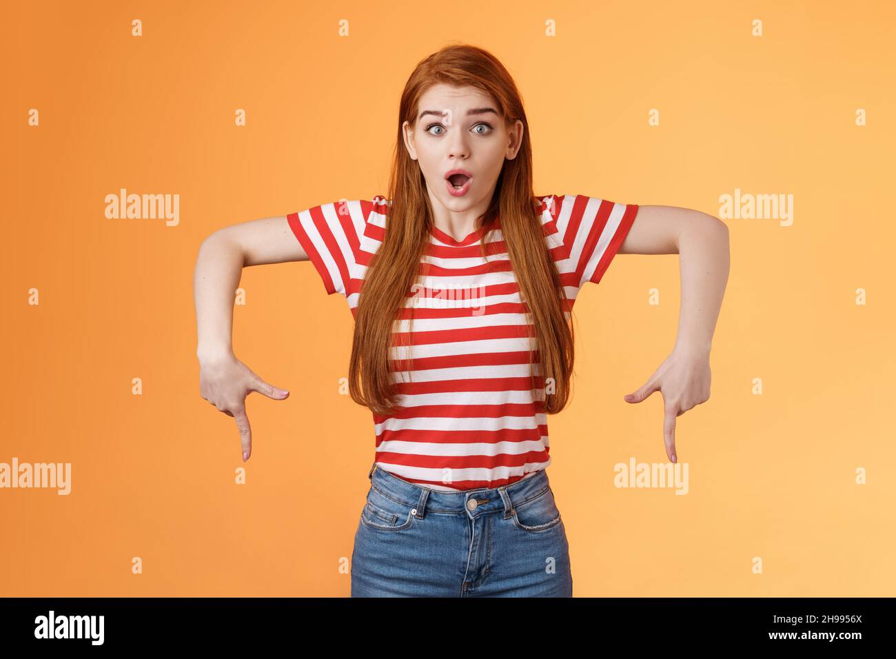 Shocked excited attractive redhead woman gasping, drop jaw shook, stare ...