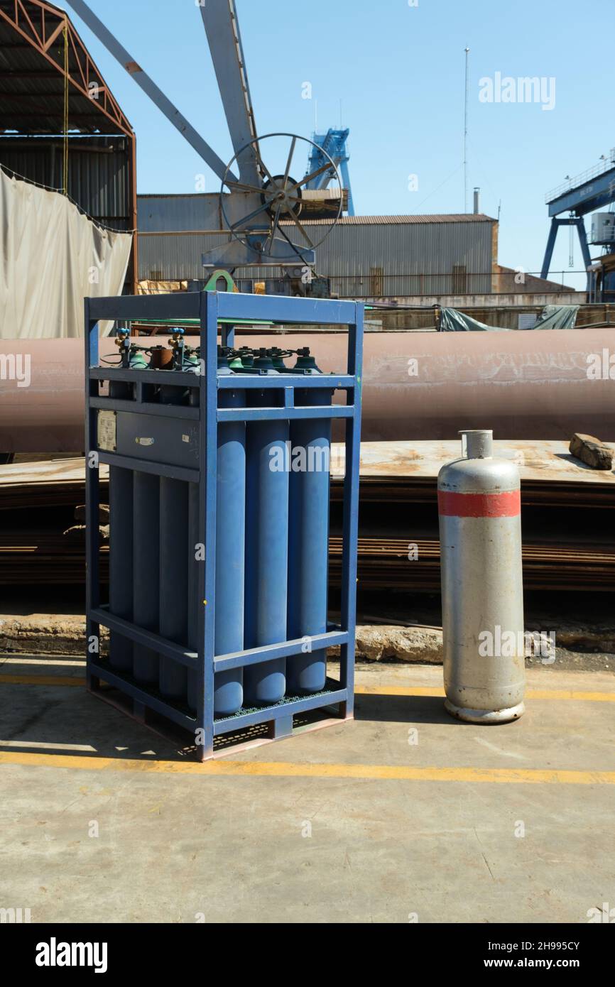 Industrial lpg cylinder and blue oxygen cylinders Stock Photo - Alamy
