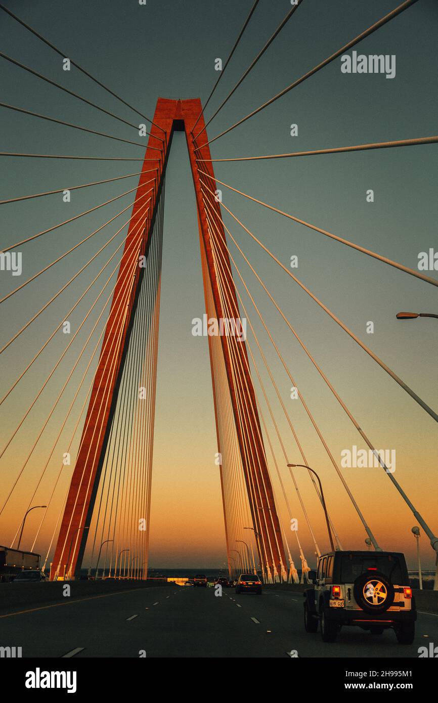 A vertical shot of the Arthur Ravenel Jr. Bridge during the sunset in ...