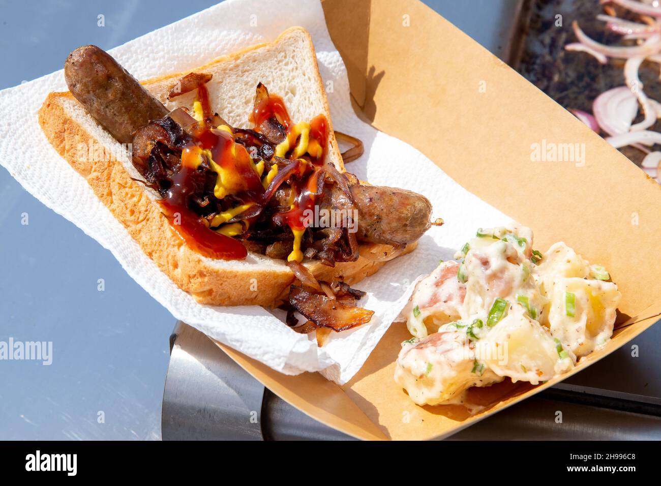 Hot dog covered in mustard and ketchup hi-res stock photography and ...