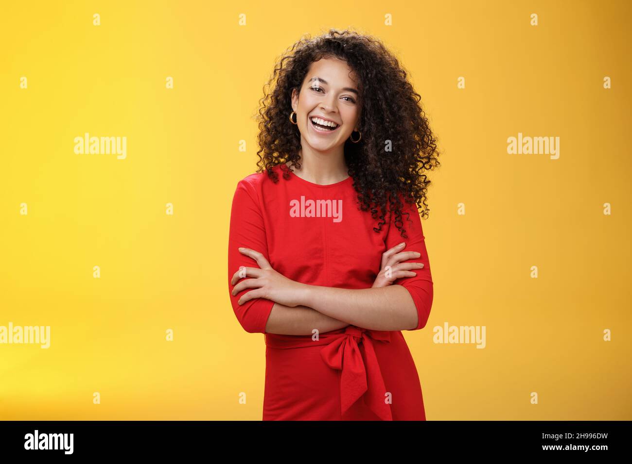 Self-assured happy enthusiastic curly-haired female reporter in cute ...