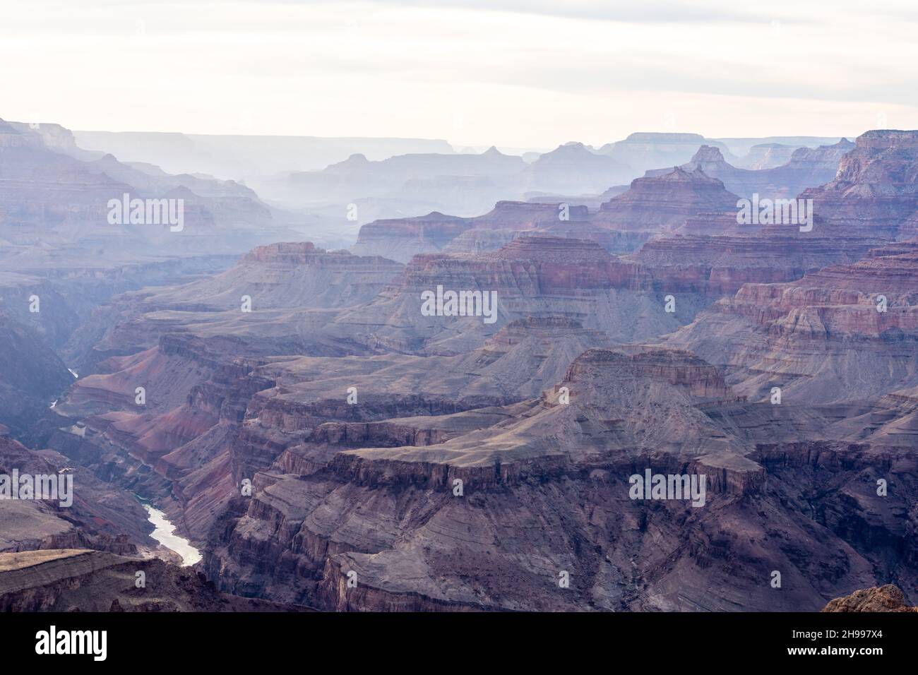 Hazy Layers of the Grand Canyon Pyramids with the Colorado River Below ...