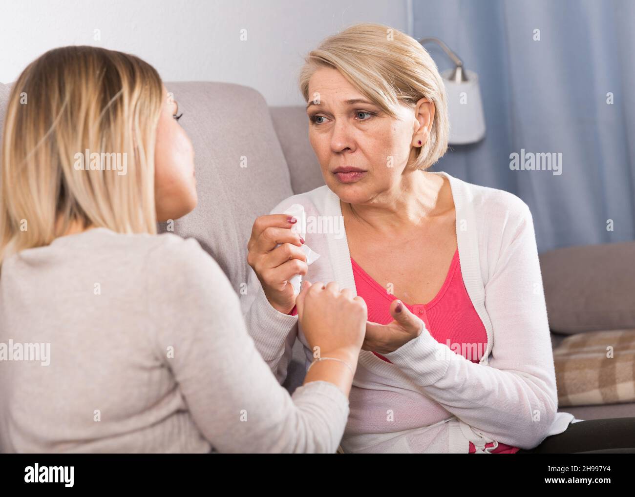 daughter comforts a sad mother Stock Photo - Alamy
