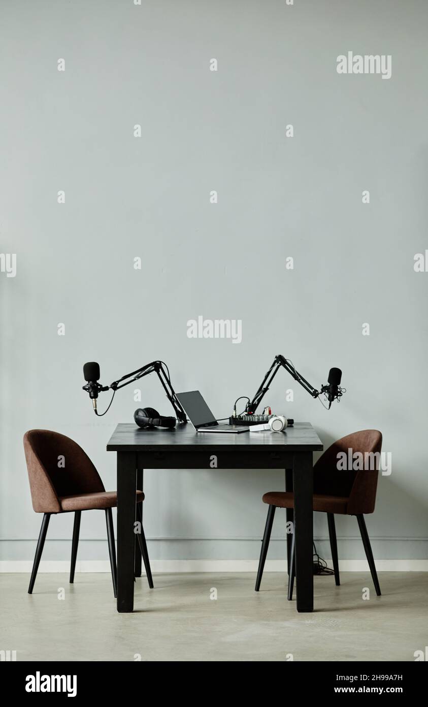 Vertical background image of podcast recording studio with two chairs ...