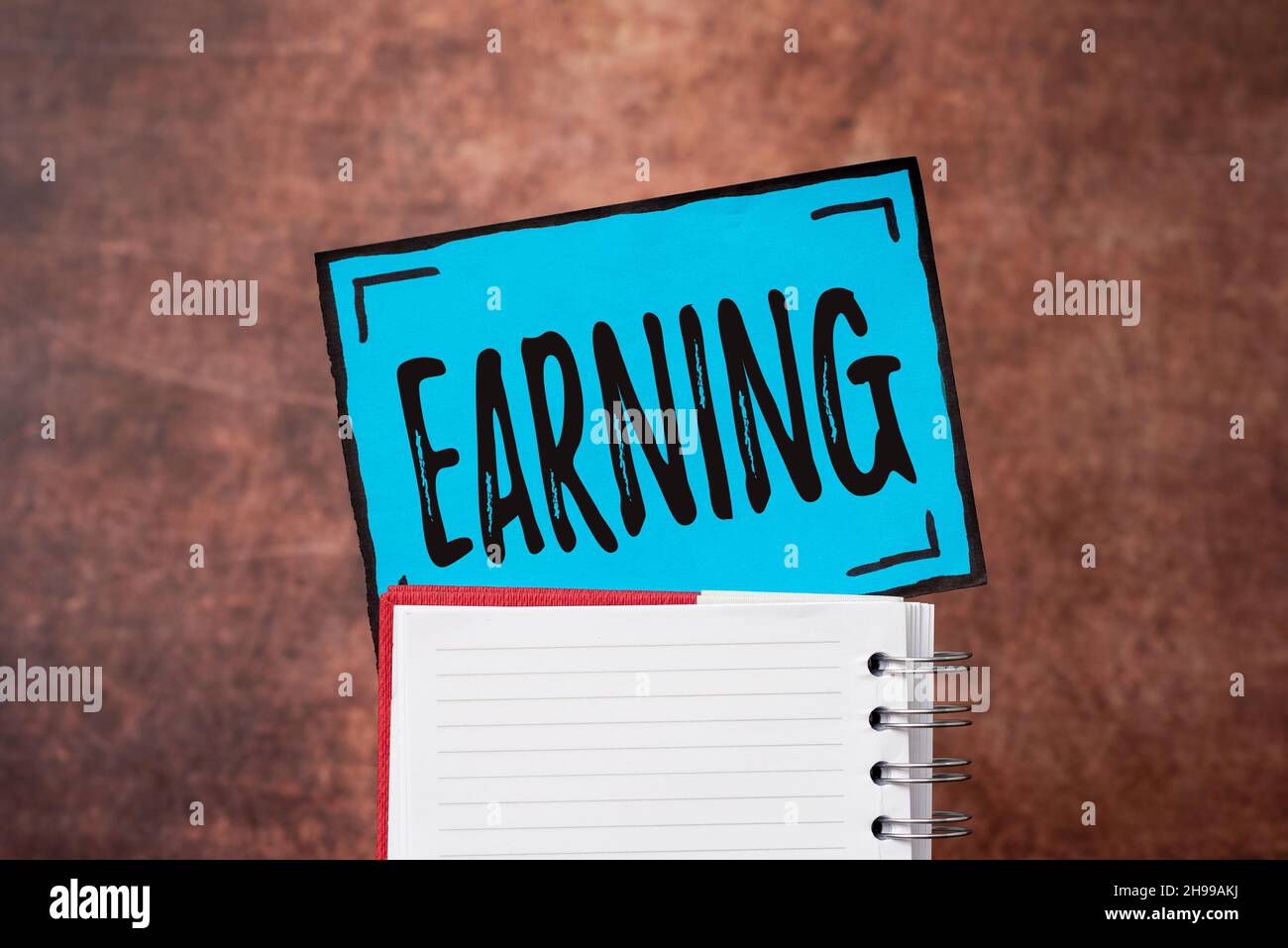 Conceptual caption Earning. Word Written on something earned as ...