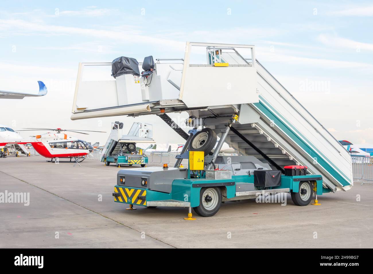 Machine mobile ladder stairs at the airport on the airfield in the ...