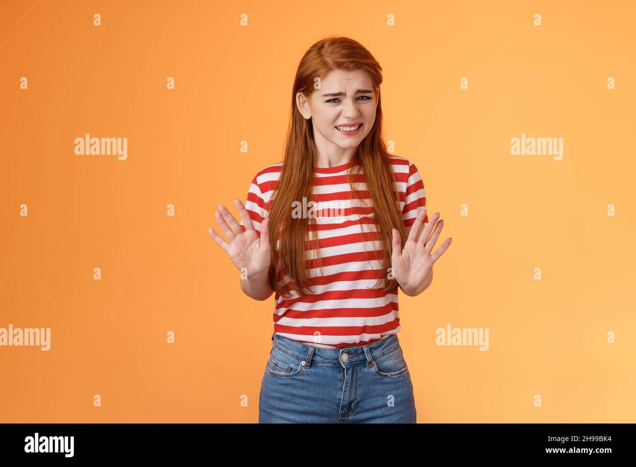 Reluctant bothered cute redhead girl apologizing make stop refusal sign ...