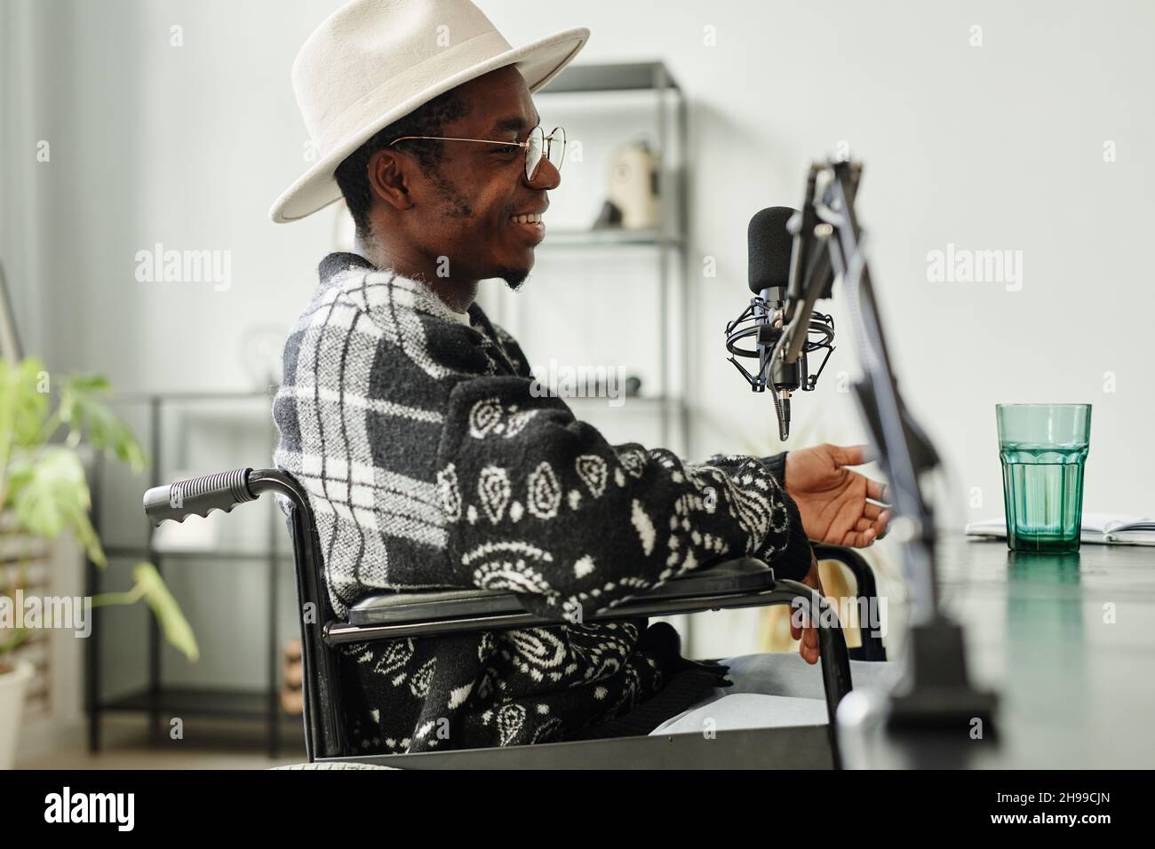 Side view portrait of African-American person with disability giving ...