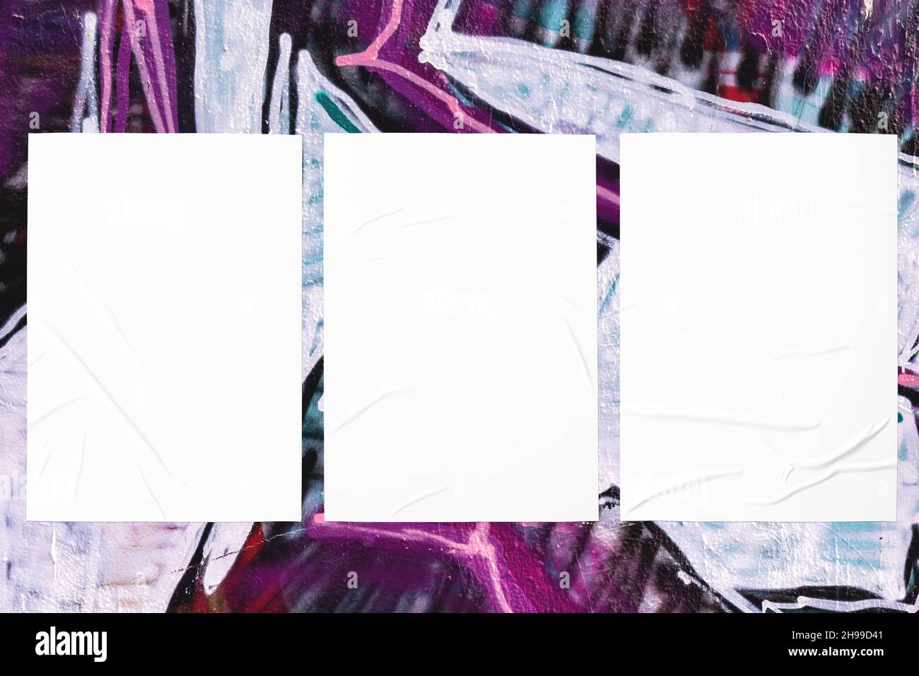 colorful urban wall texture with three wrinkled glued poster templates ...
