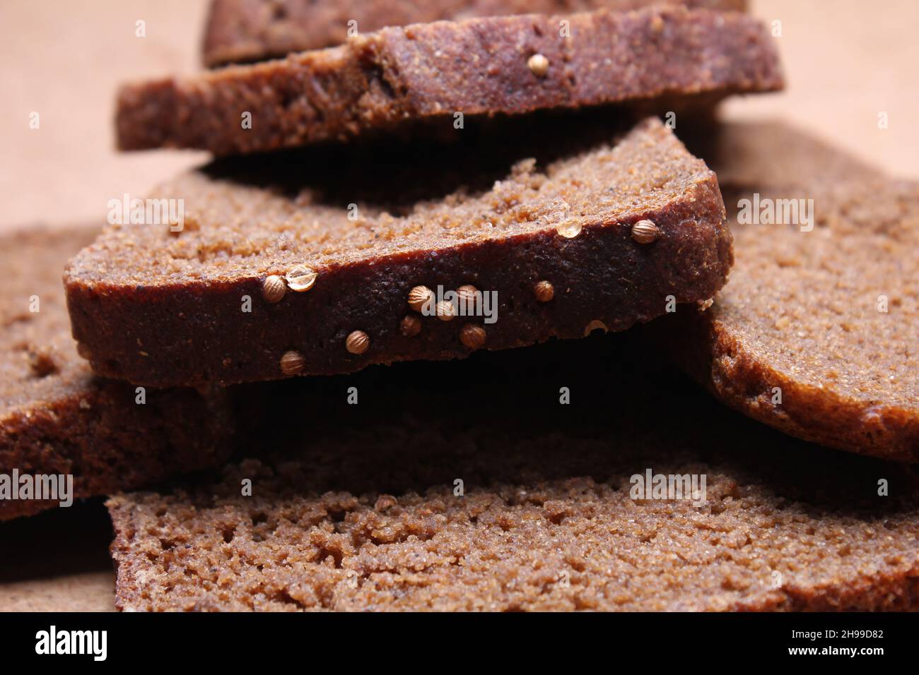 black bread, sliced on a wooden stand Stock Photo - Alamy