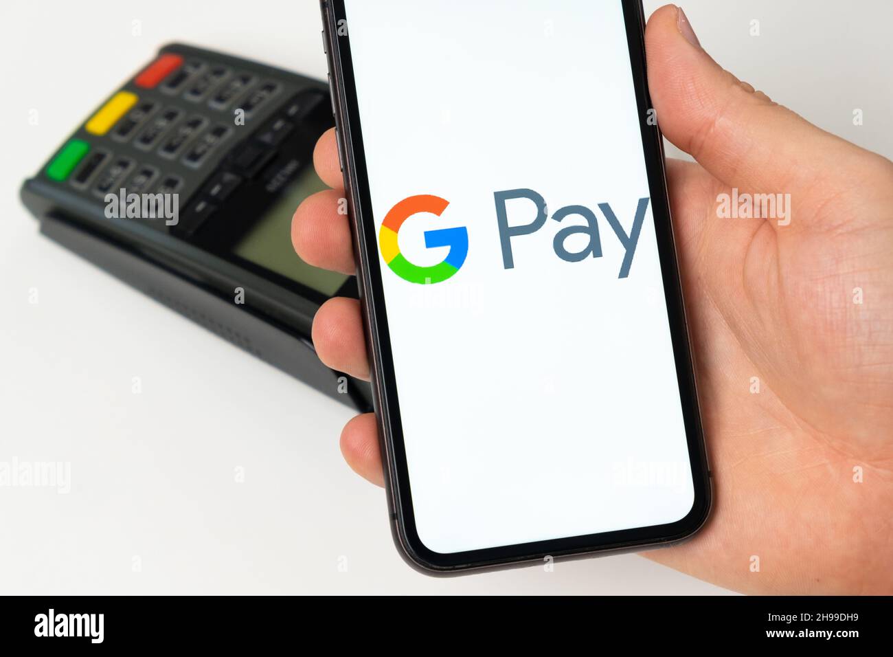 Google Pay mobile application for online payment. A man uses a mobile ...