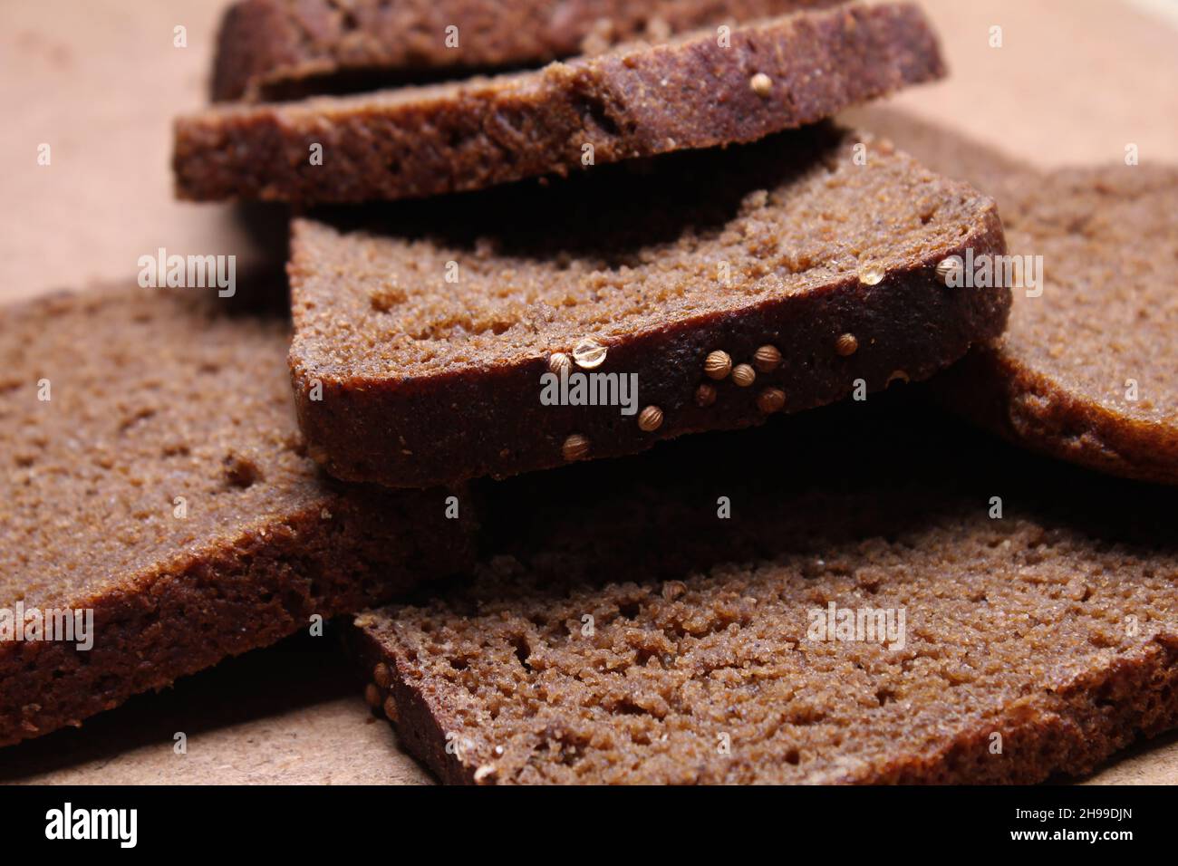 black bread, sliced on a wooden stand Stock Photo - Alamy