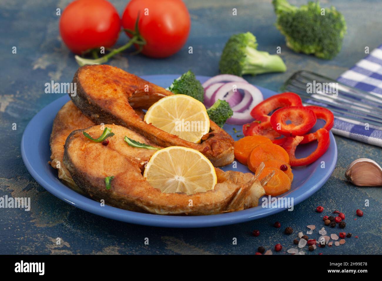 Christmas carp, Fried carp fish slices on a blue plate. Fried golden ...