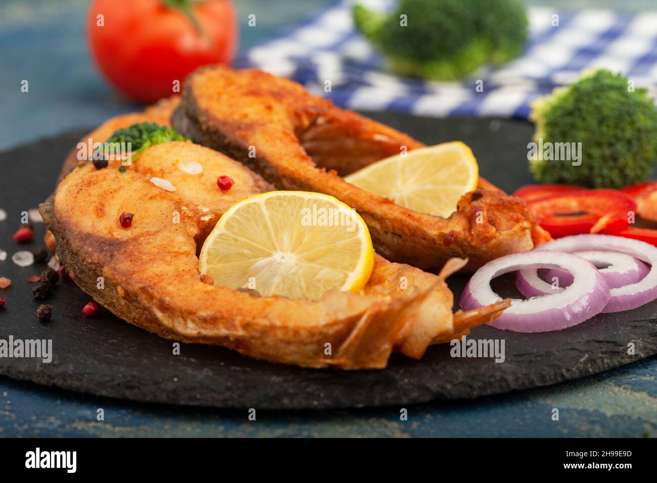 Christmas carp, Fried carp fish slices on a blue plate. Fried golden ...