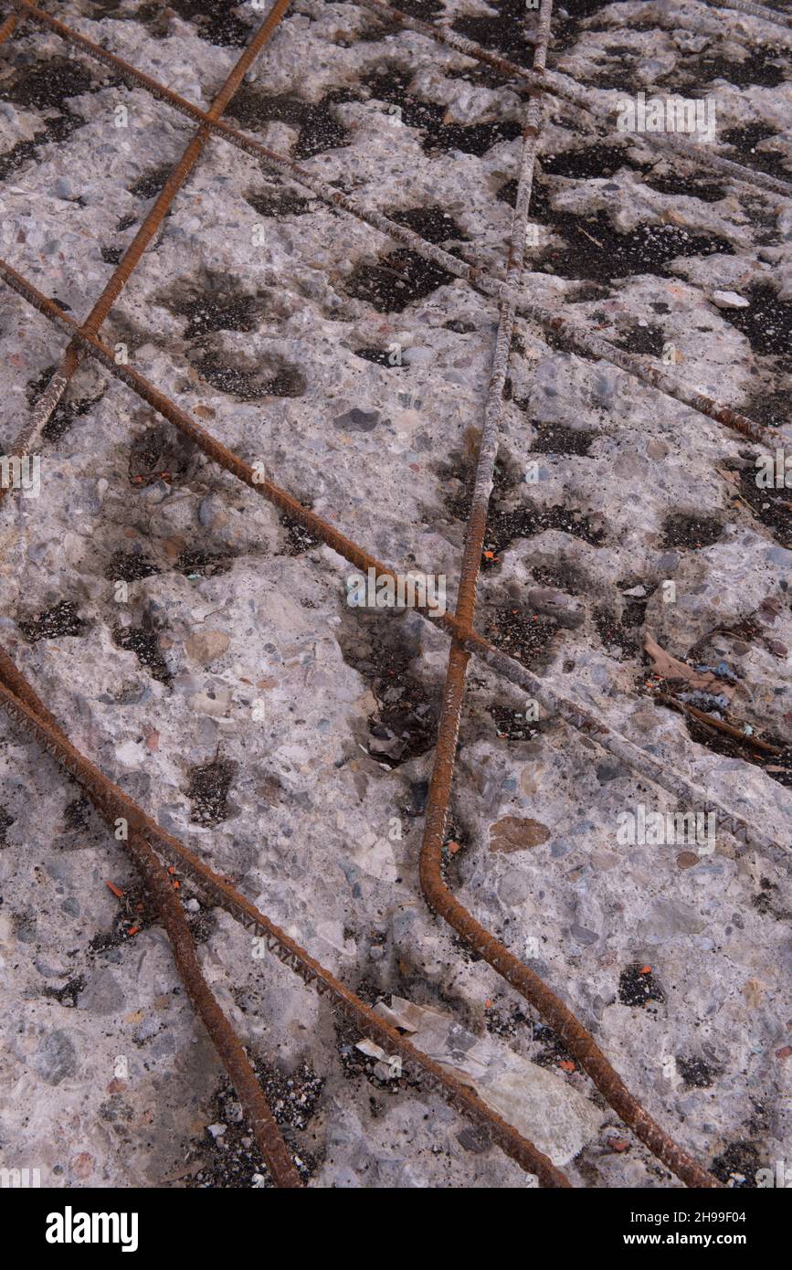 Old rusty construction rebar on a bridge road bed just prior to being ...