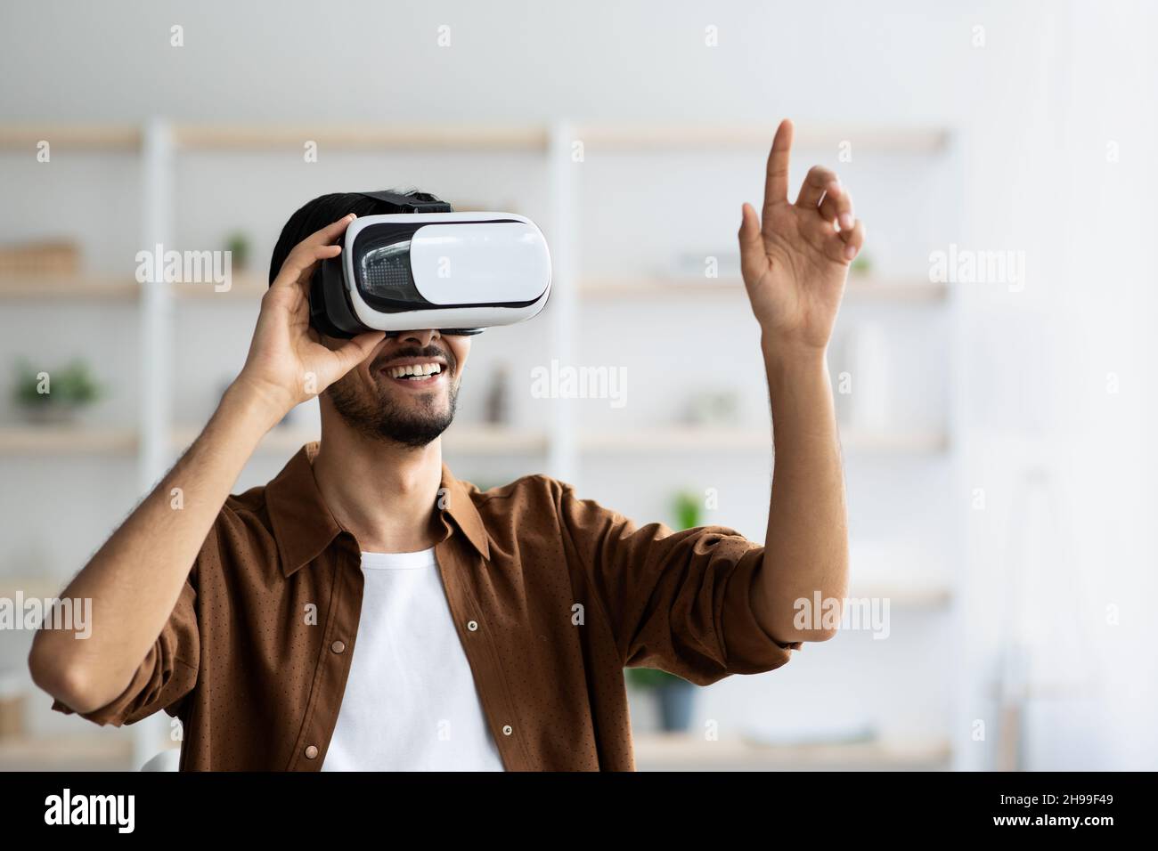 Young man pointing camera using hi-res stock photography and images - Alamy