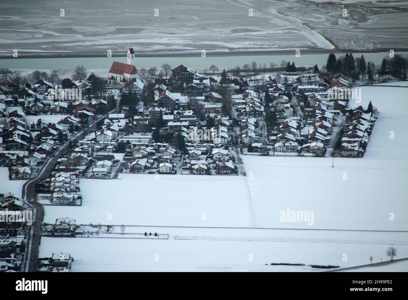 An aerial view of a snow-covered village in Fussen, Alps, Germany Stock ...