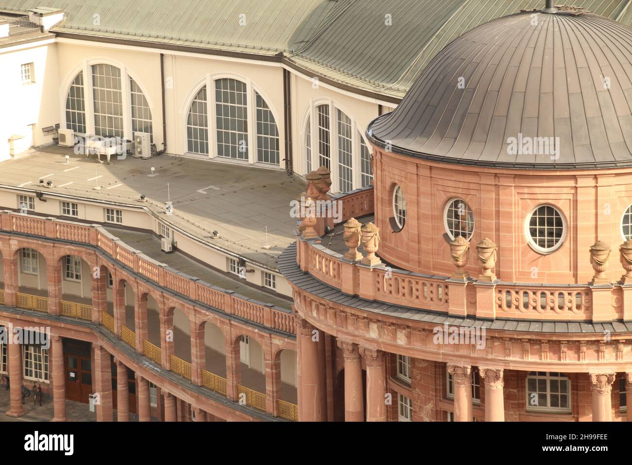 A building with a round rooftop and arched balconies on a sunny day ...