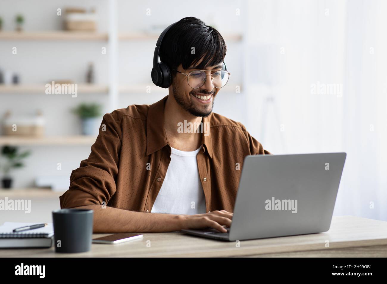 Indian man headset laptop hi-res stock photography and images - Alamy