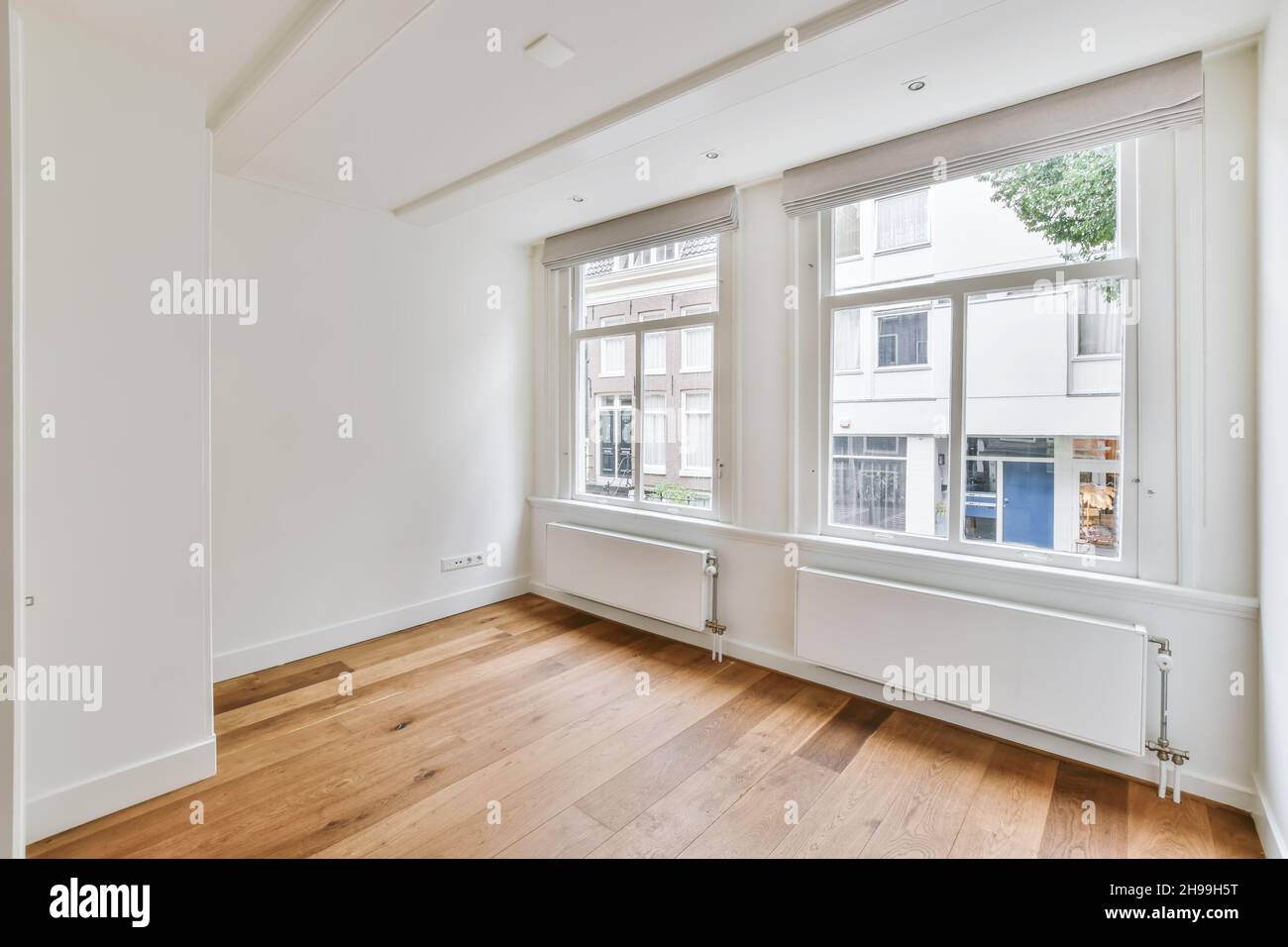 Cozy and comfortable bright room with big windows Stock Photo - Alamy