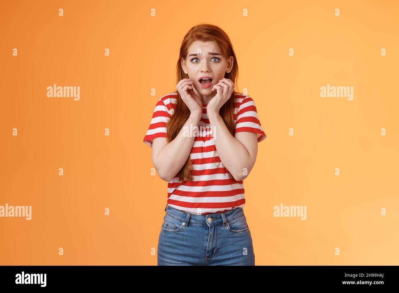 Innocent scared redhead female victim feel afraid standing stupor ...