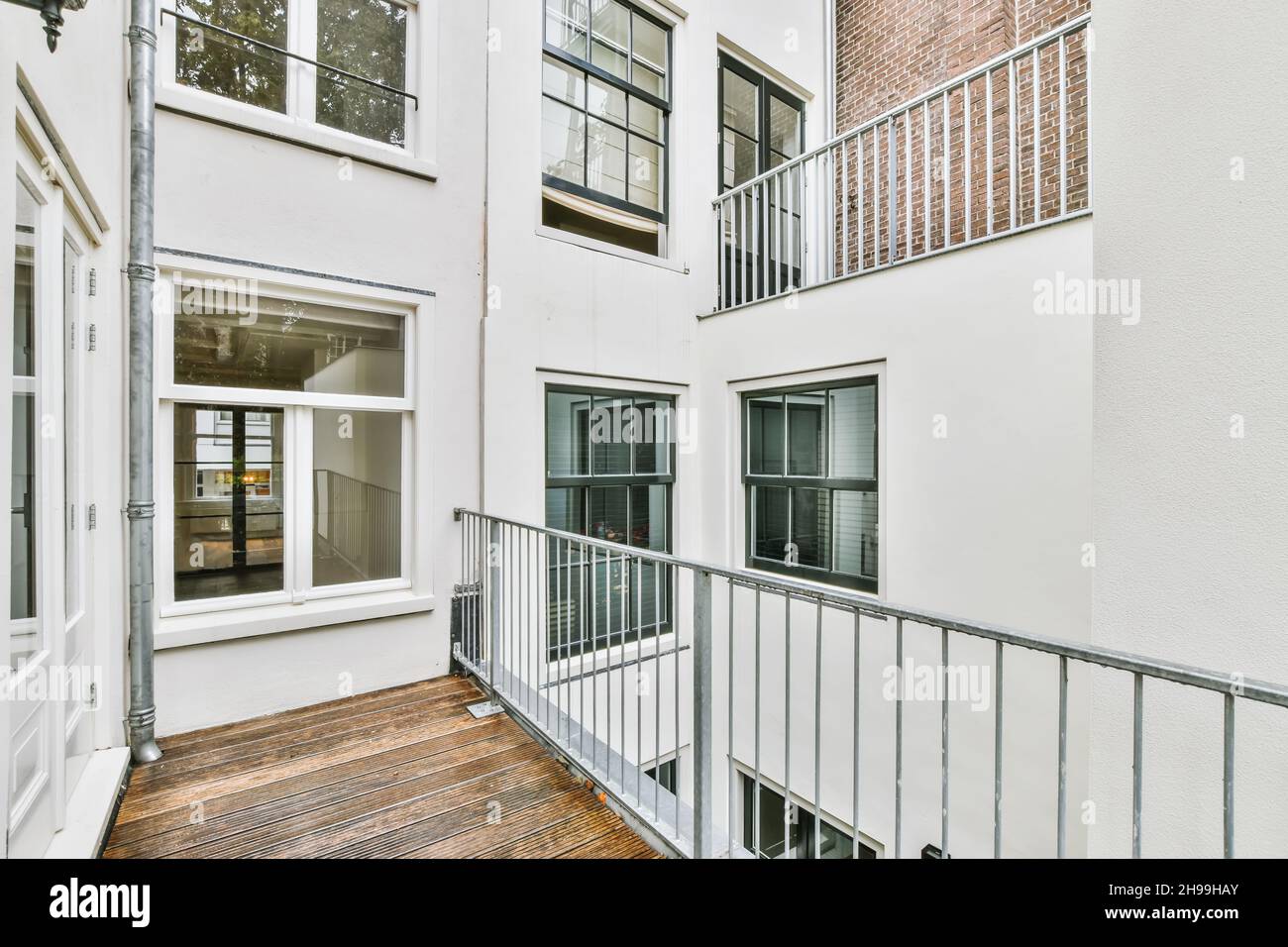 Cozy pretty balcony with comfortable railings and wooden floor Stock ...