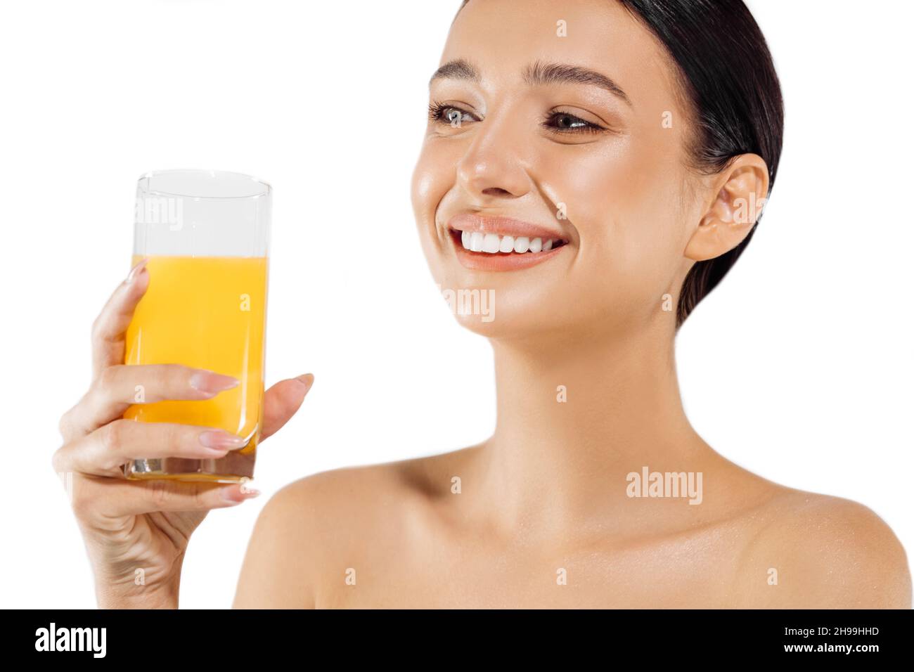 Beautiful Young Woman With A Glass Of Orange Juice Drinking Fresh Orange Juice On An Isolated 