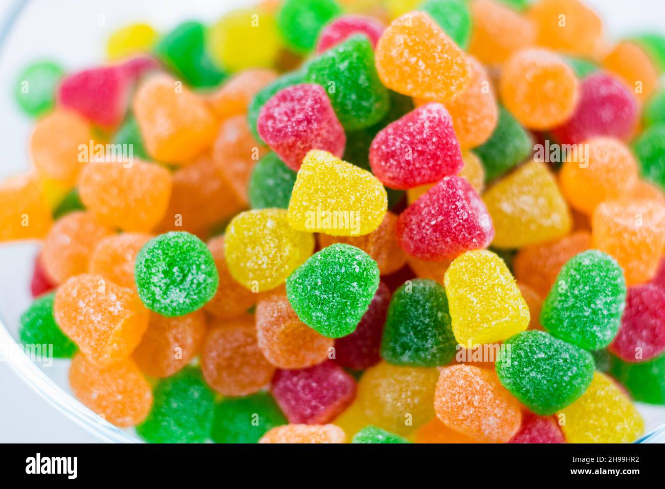 Sugar Jelly candies. Sugar jelly candies on the bowl in focus. Close up ...