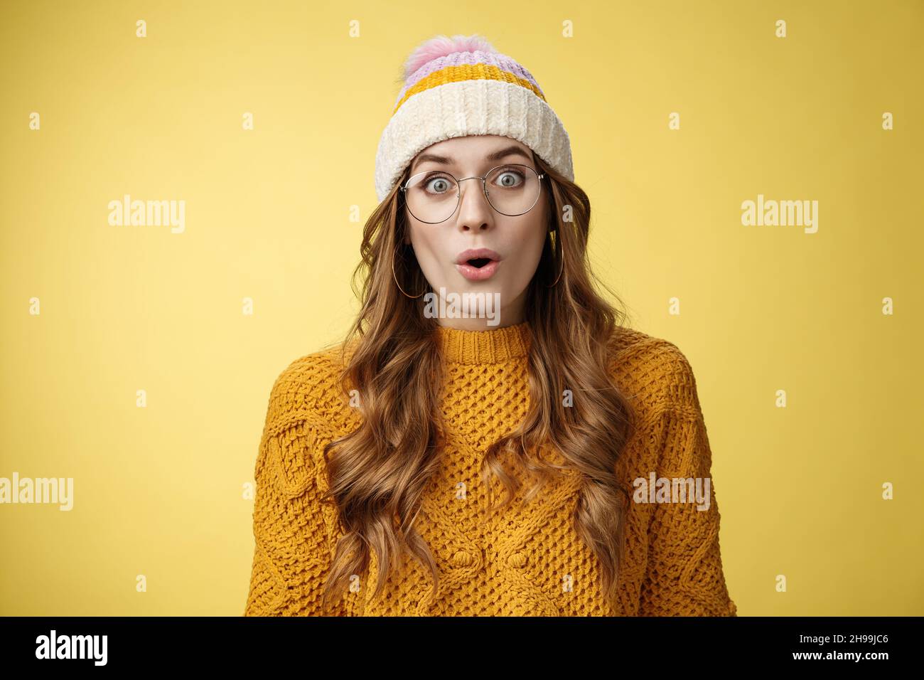 Surprised amazed charismatic good-looking young female student widen ...